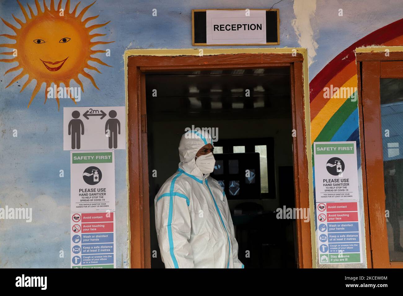 Health Worker wearing PPE Personal Protective Equipment Kit at School ...