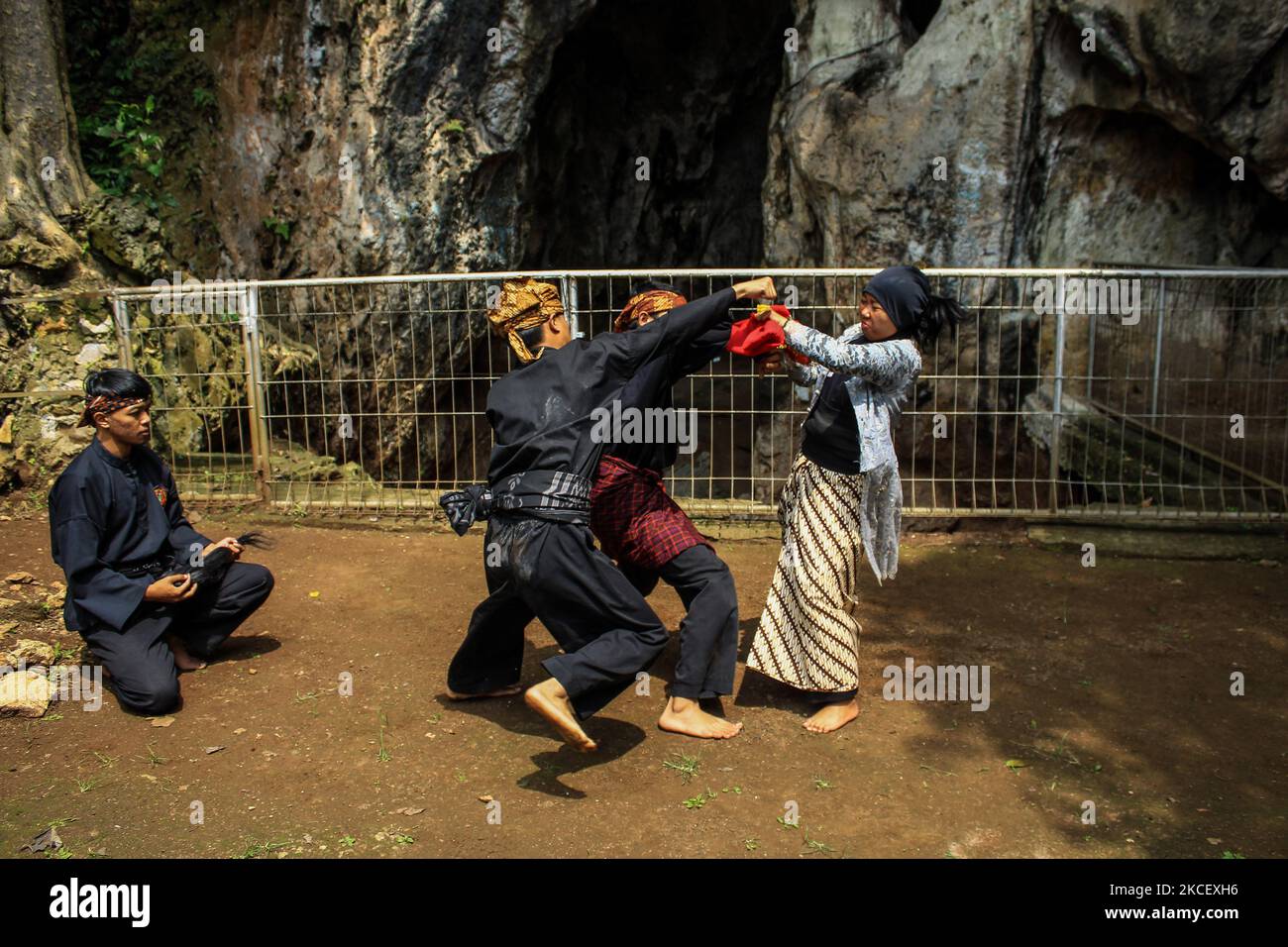 Students from the pencak silat hermitage show their actions during ...