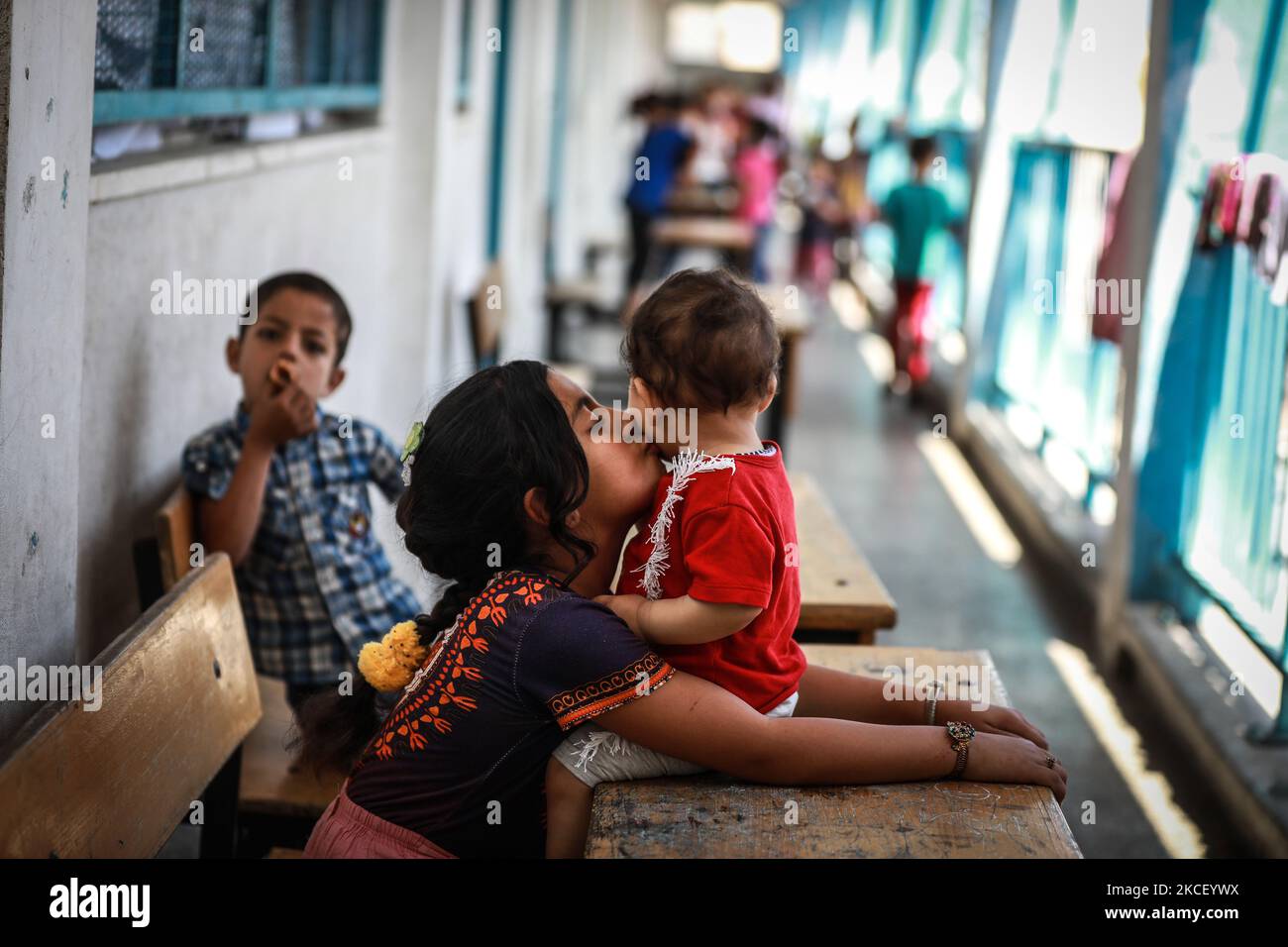 A picture made available on 20 May 2021 shows Palestinian children join ...