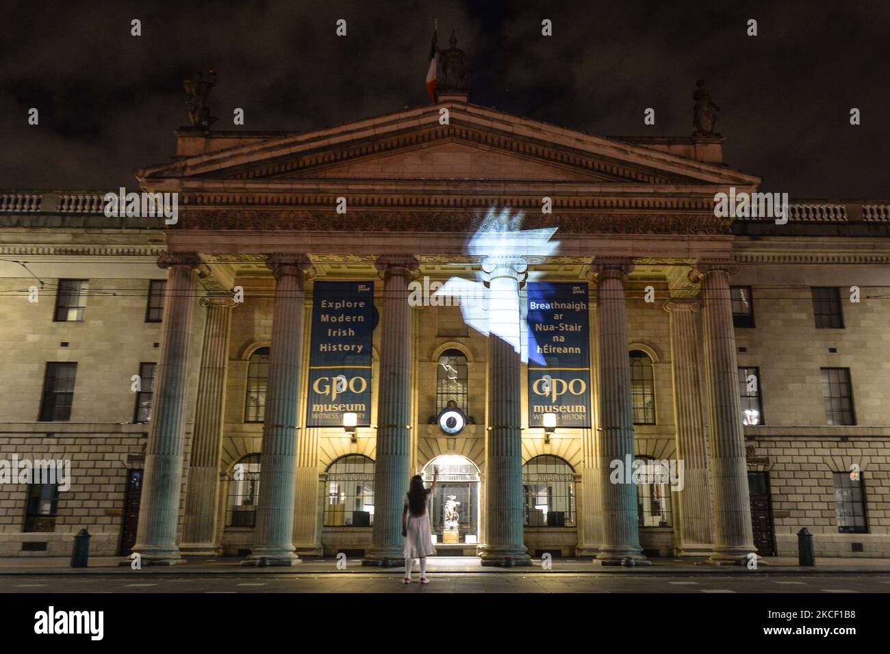Sadhbh, a little girl with her paper dove looking at illuminations at ...