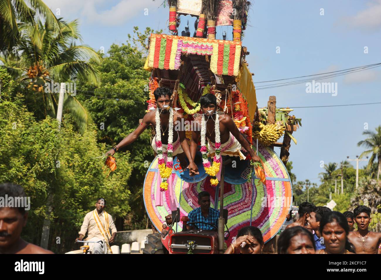 Tamil Hindu devotees perform the para-kavadi ritual while on route to ...