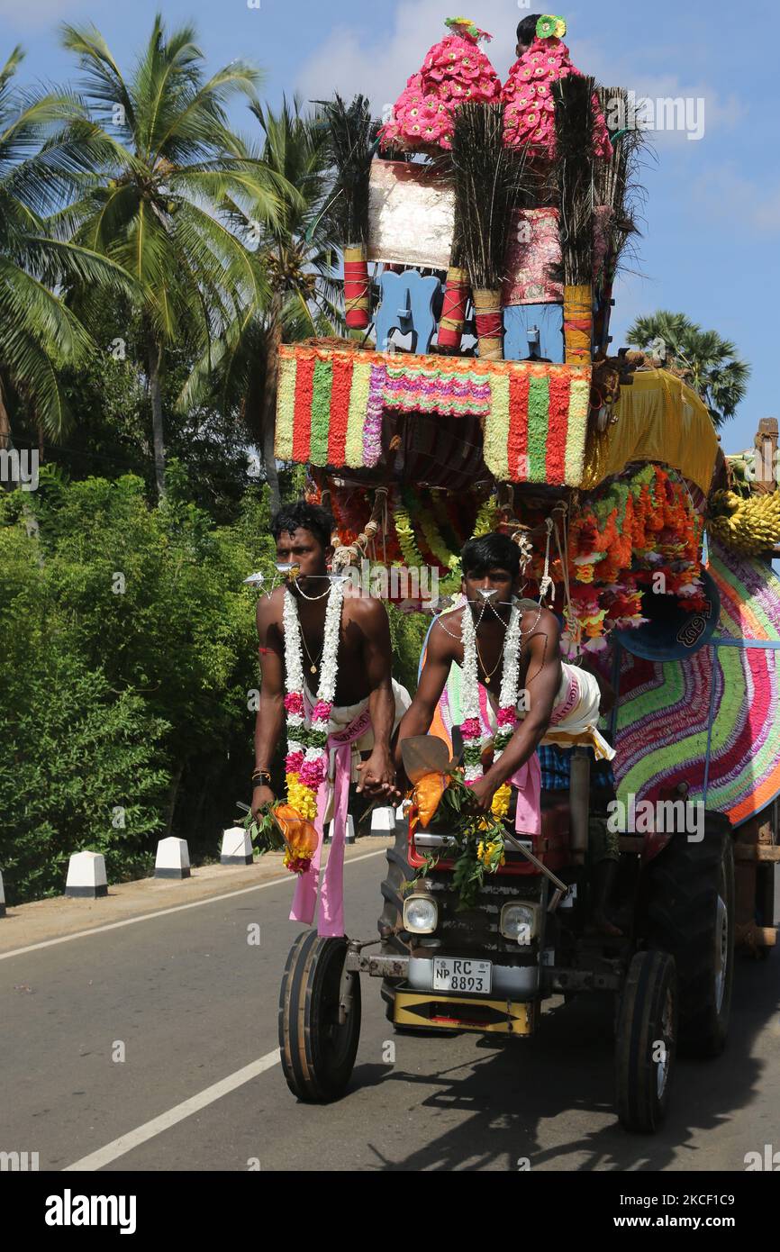 Tamil Hindu devotees perform the para-kavadi ritual while on route to ...