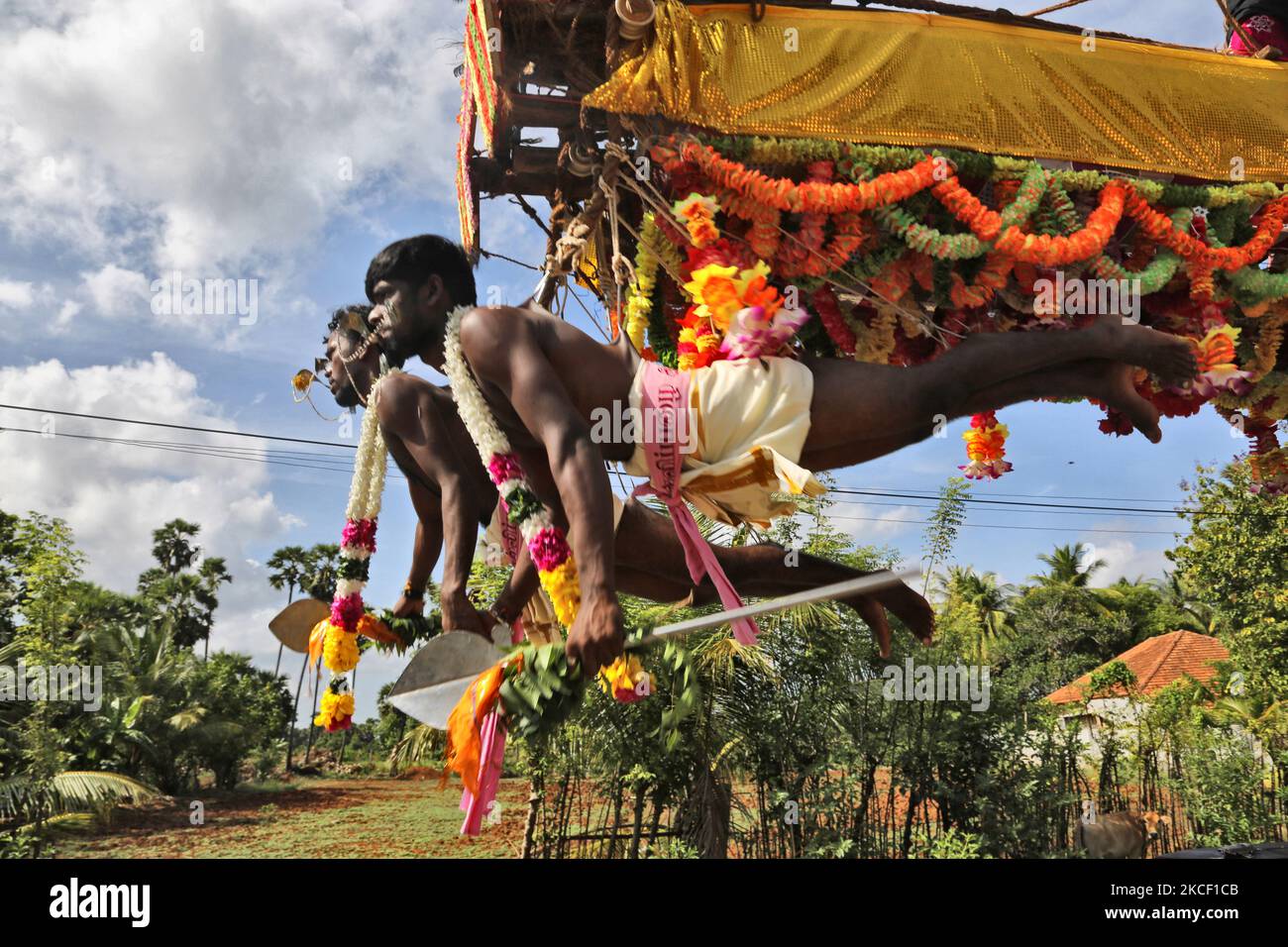 Tamil Hindu devotees perform the para-kavadi ritual while on route to ...