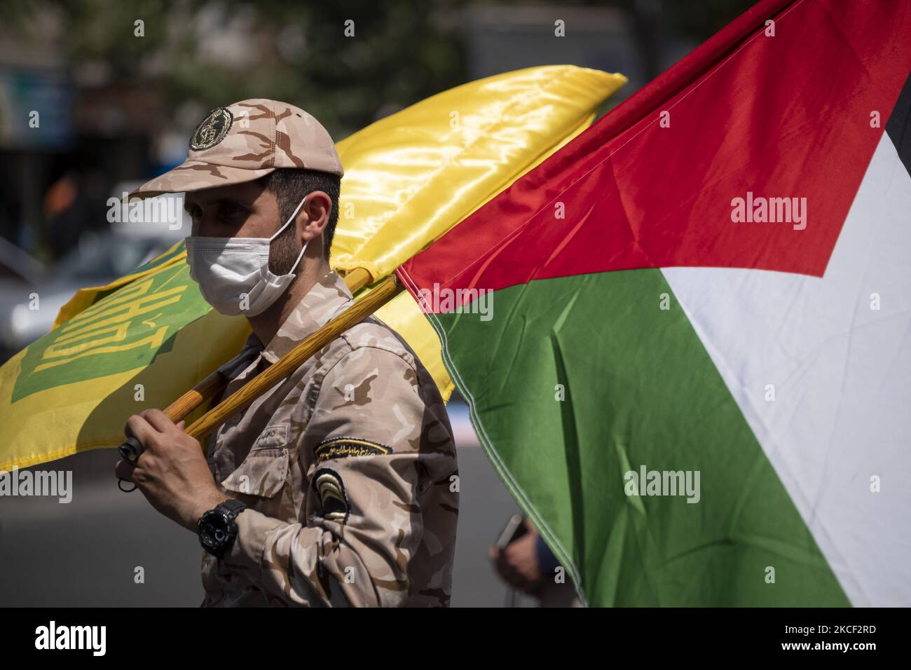 A member of the Islamic Revolutionary Guard Corps (IRGC) carrying a ...