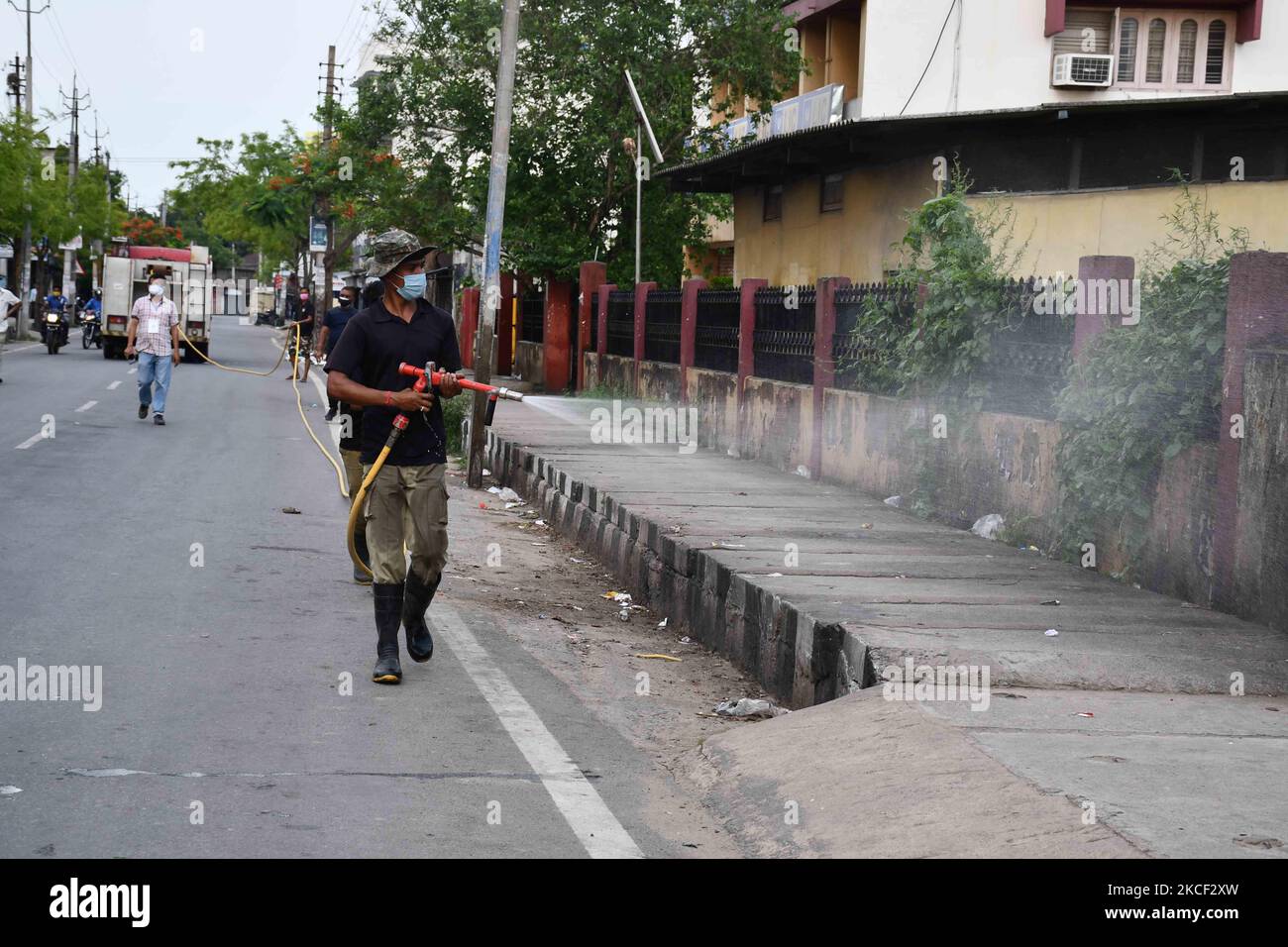State Disaster Response Fund (SDRF) and Fire brigade officials spray ...