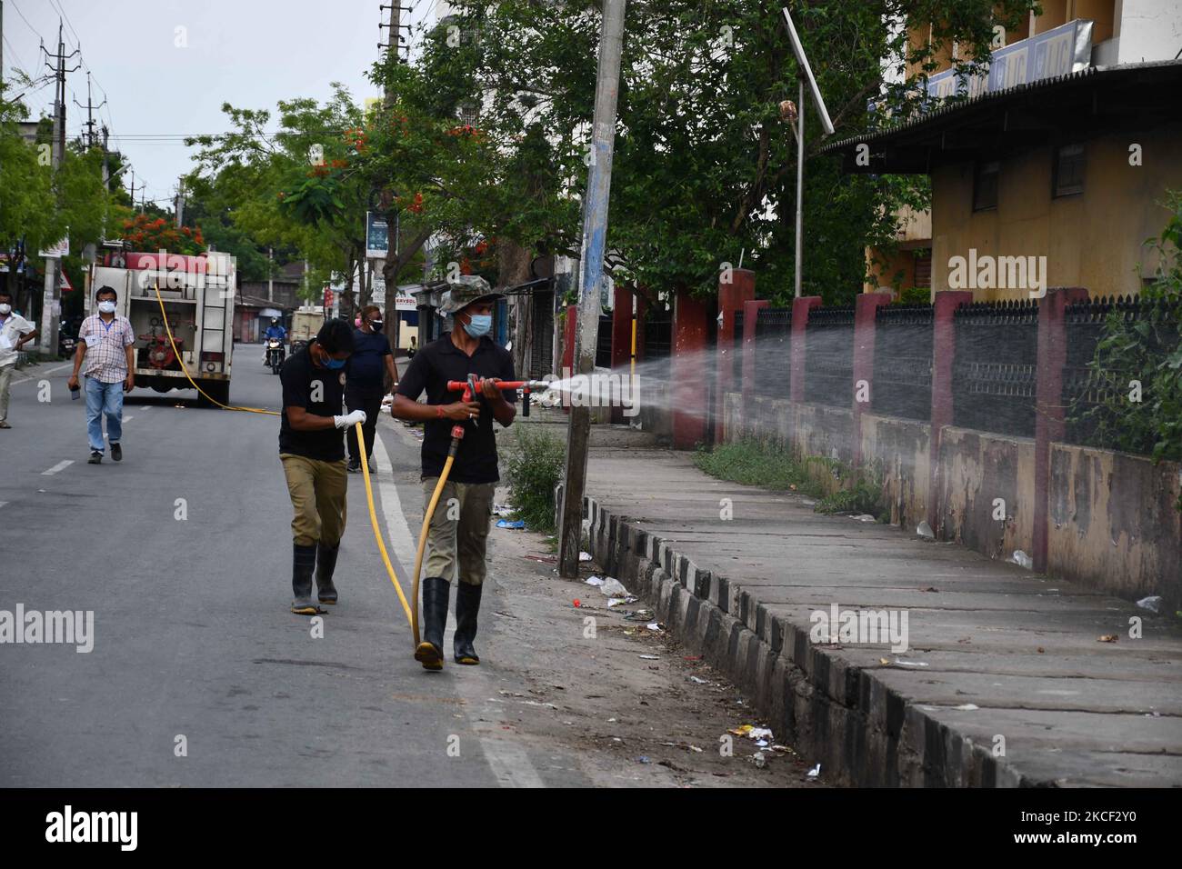State Disaster Response Fund (SDRF) and Fire brigade officials spray ...