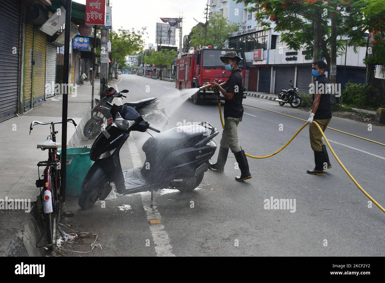 State Disaster Response Fund (SDRF) and Fire brigade officials spray ...