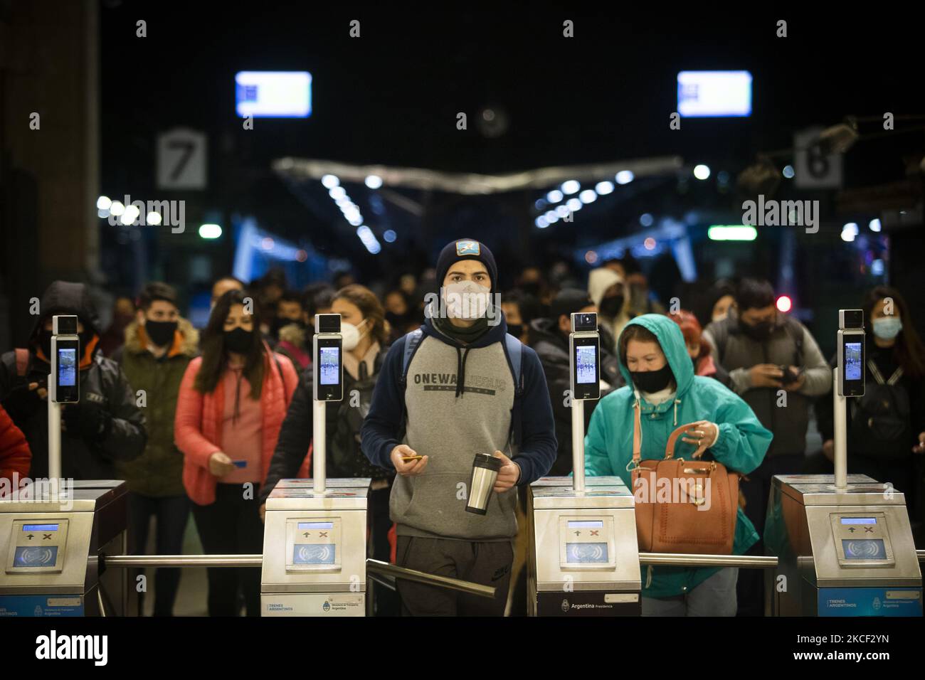 Commuters walk trough ticket machines at Constitucion train station ...