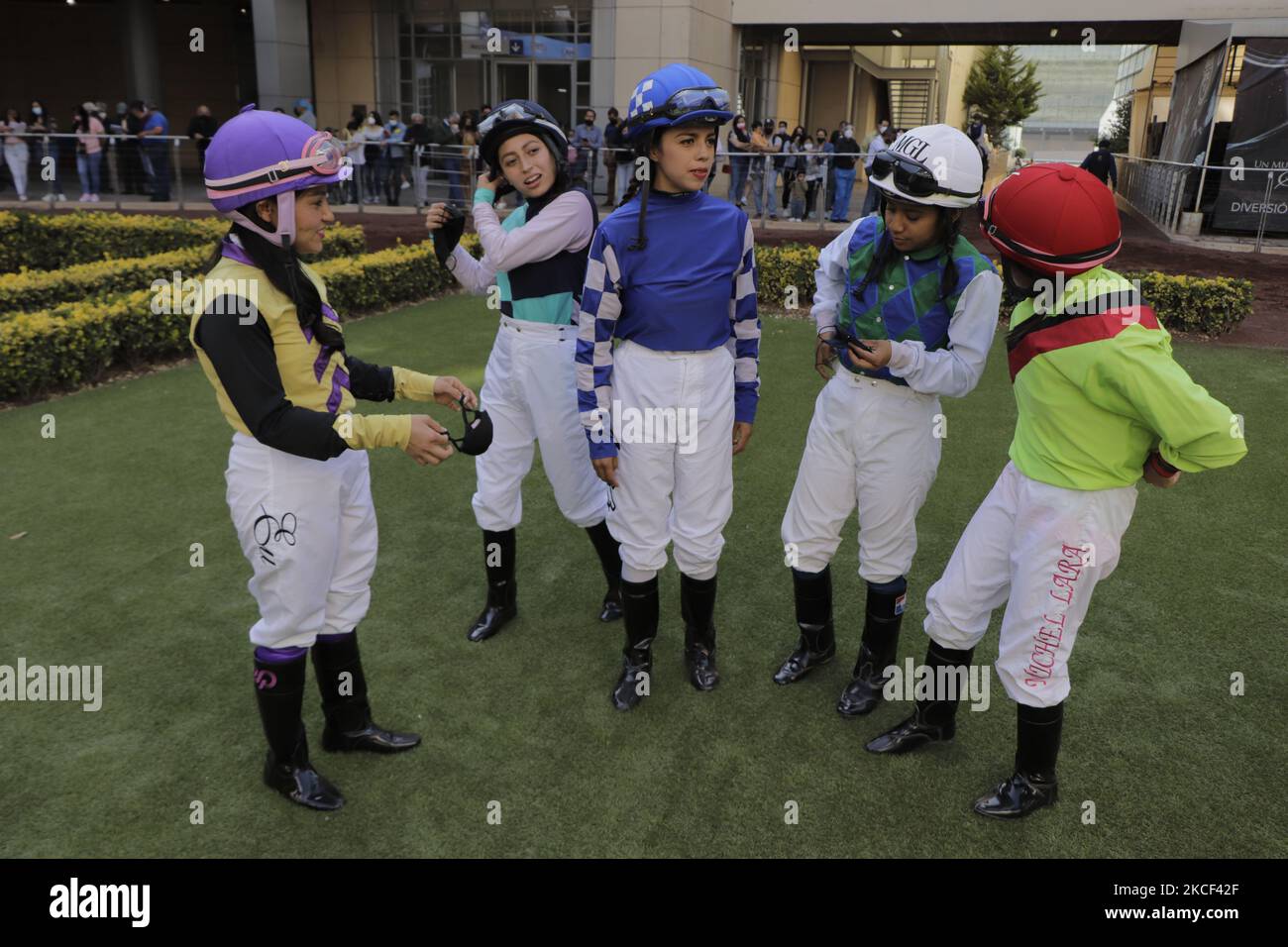Women jockeys in the saddling area at the Hipódromo de Las Américas in ...