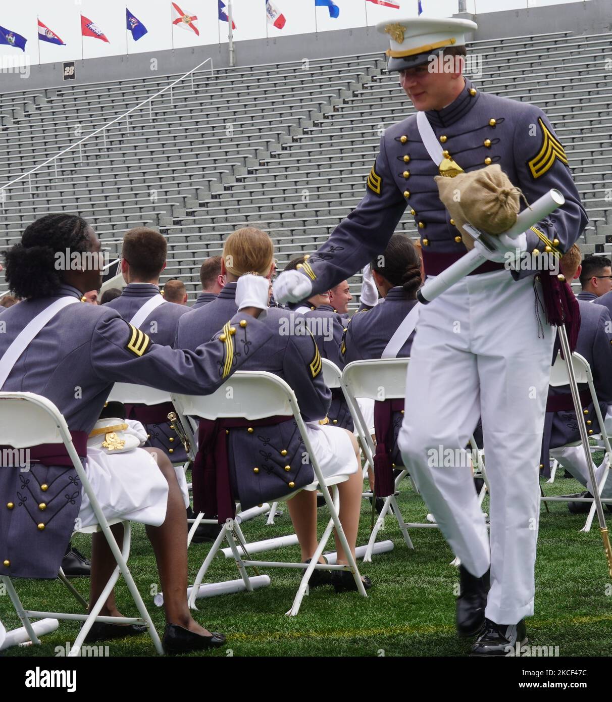 A West Point graduate walks to his seat after receiving his diploma ...