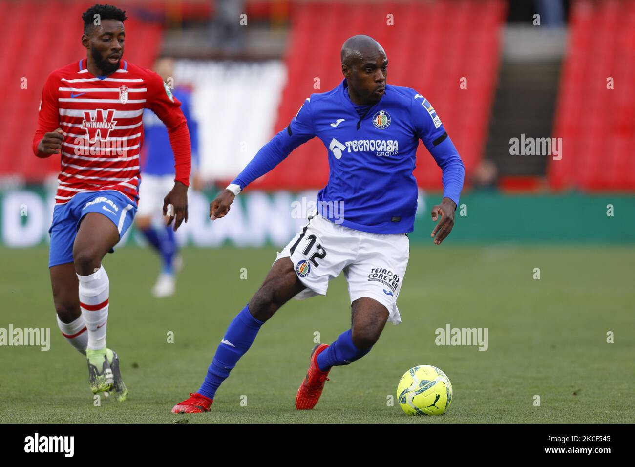 Allan Nyom, of Getafe CF and Yan Eteki, of Granada CF during the La ...