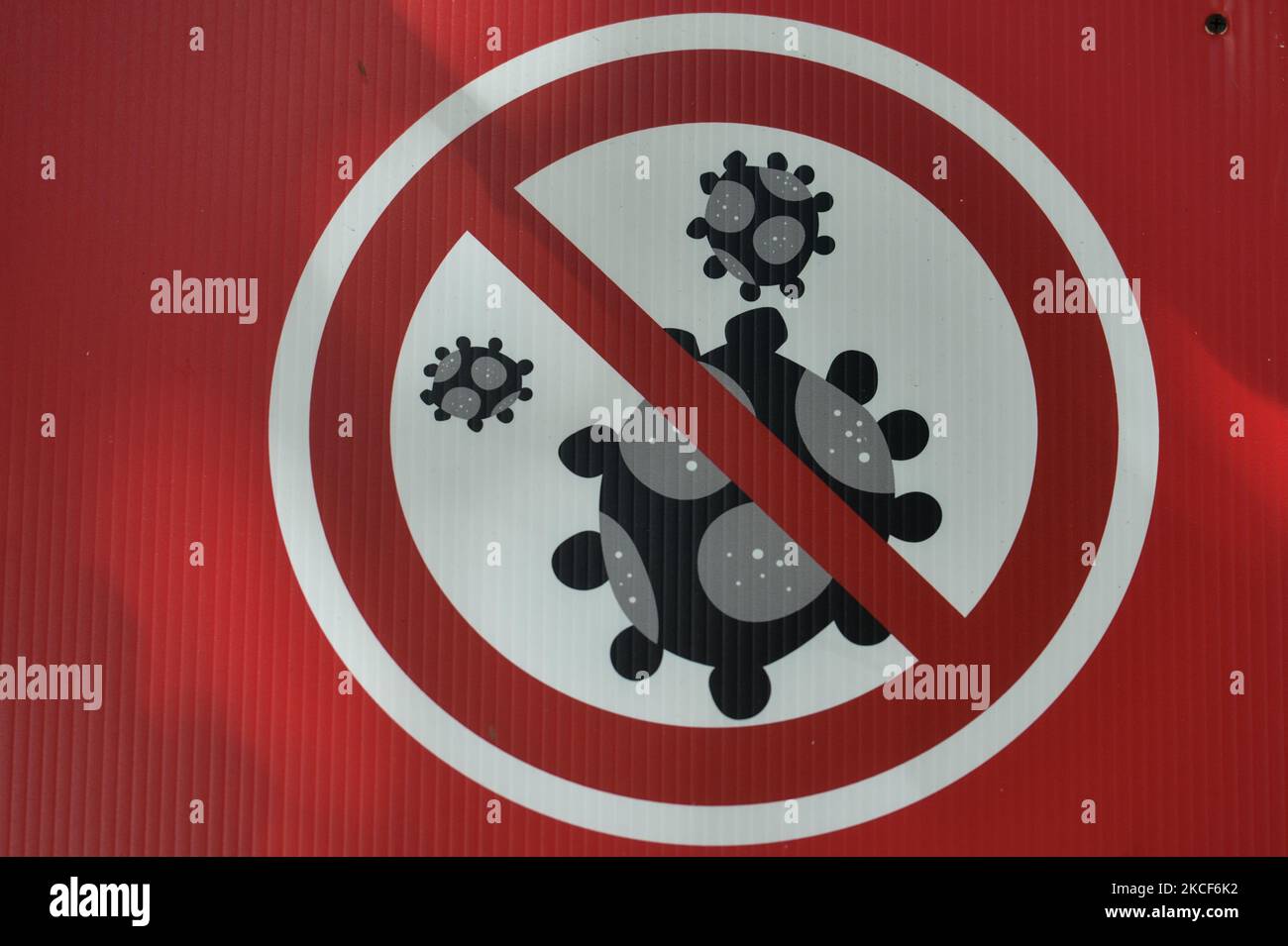 Coronavirus (Covid-19) related sign at the entrance to a construction ...