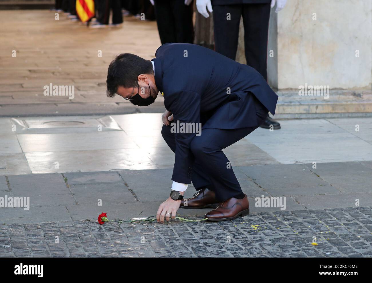 Pere Aragones lays a flower on the Stolpersteine in memory of President ...