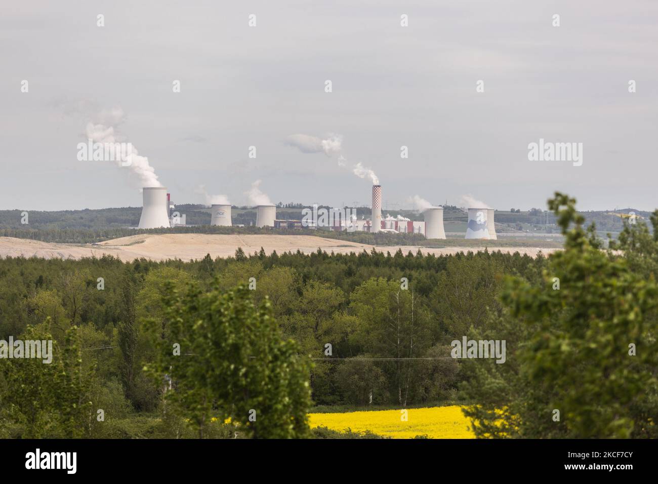 Steam rises from cooling towers of Turow coal-fired power station on ...