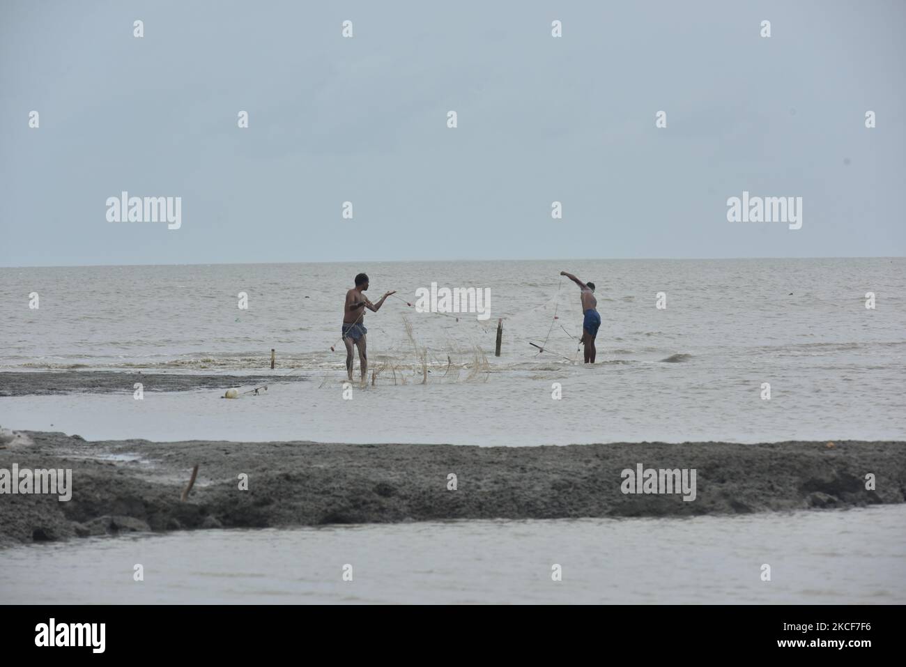 Fishermen seen working with his fishing net as a last time preparation ...