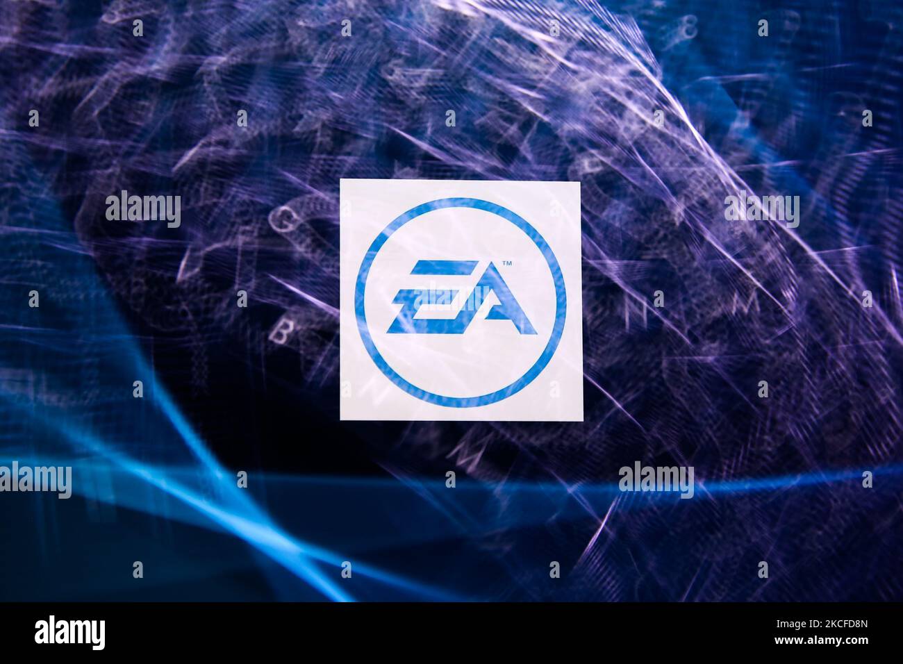 Electronic Arts logo displayed on a phone screen and a keyboard are ...