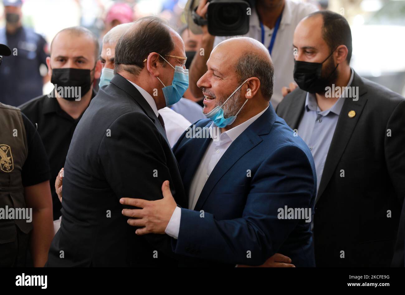 Hamas leader Khalil al-Haya (R), embraces General Abbas Kamel (L ...