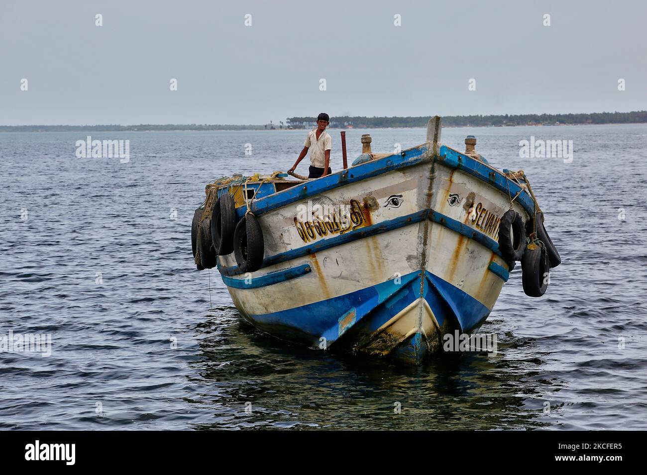 Ferry boat (passengers are seated inside below deck) arrives at the Kanaki Harbour in the Jaffna ...