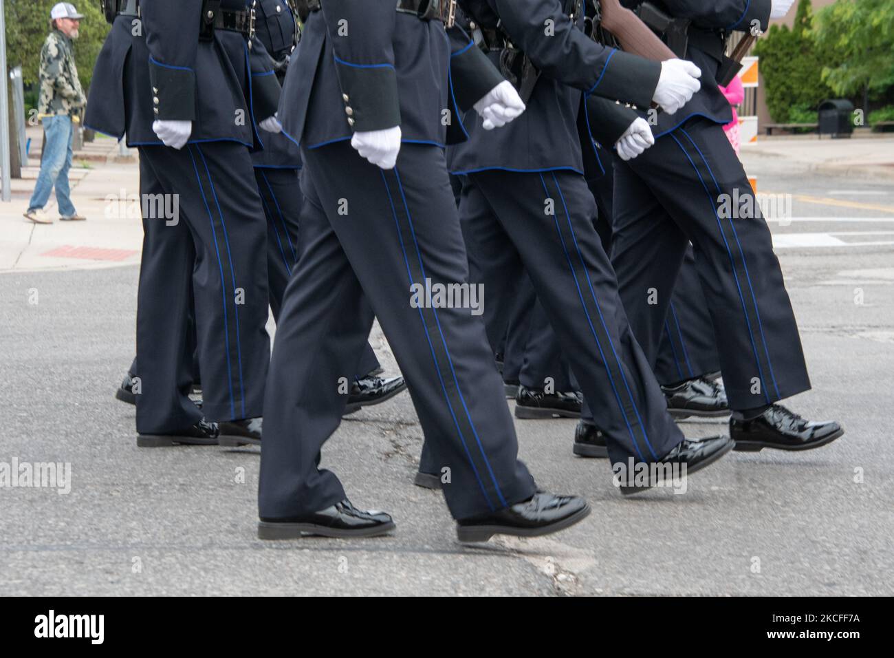 Members of the Royal Oak Police Color Guard march towards residents of ...