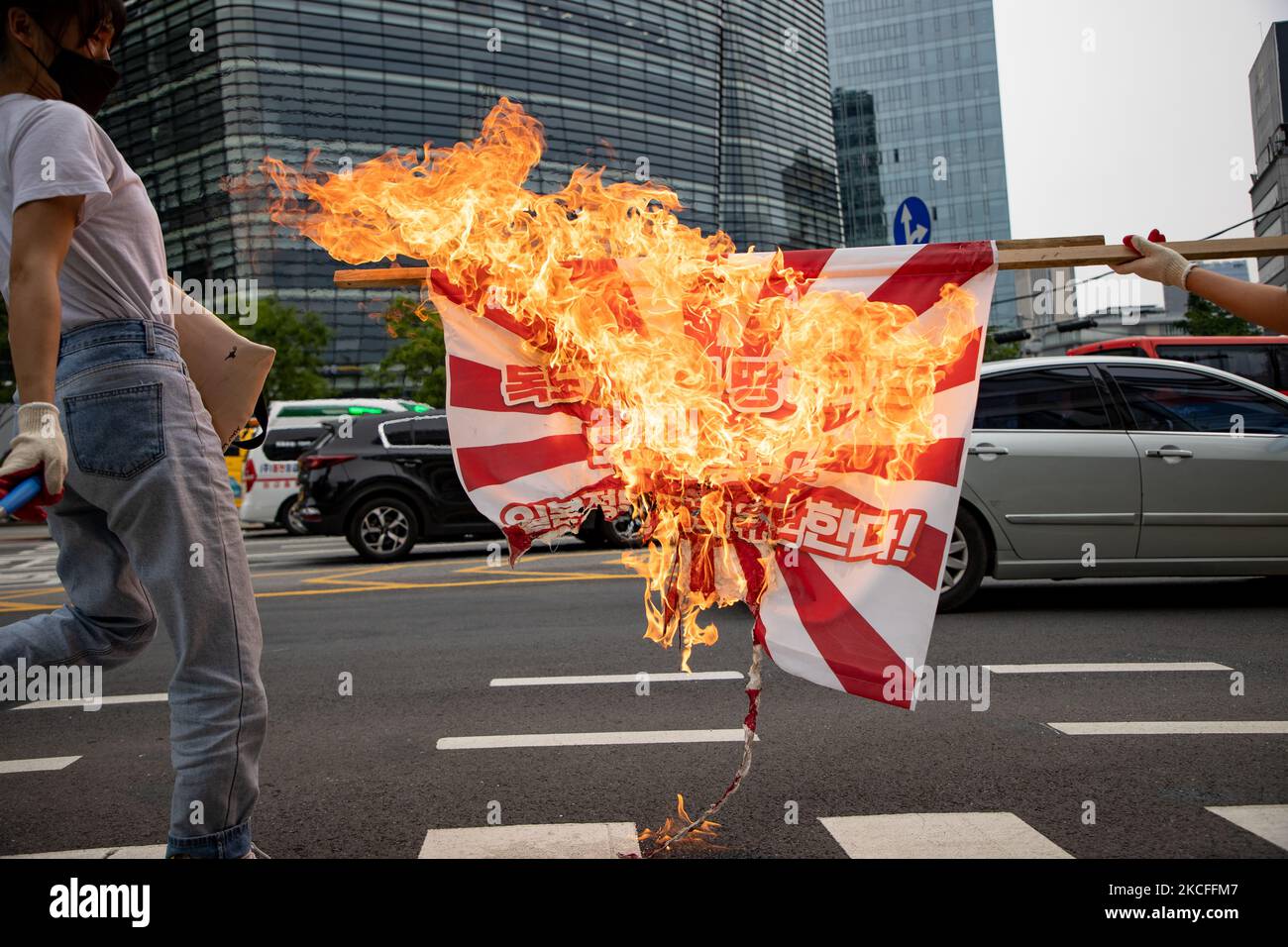 Members of the Korean University Student Progressive Association burn ...
