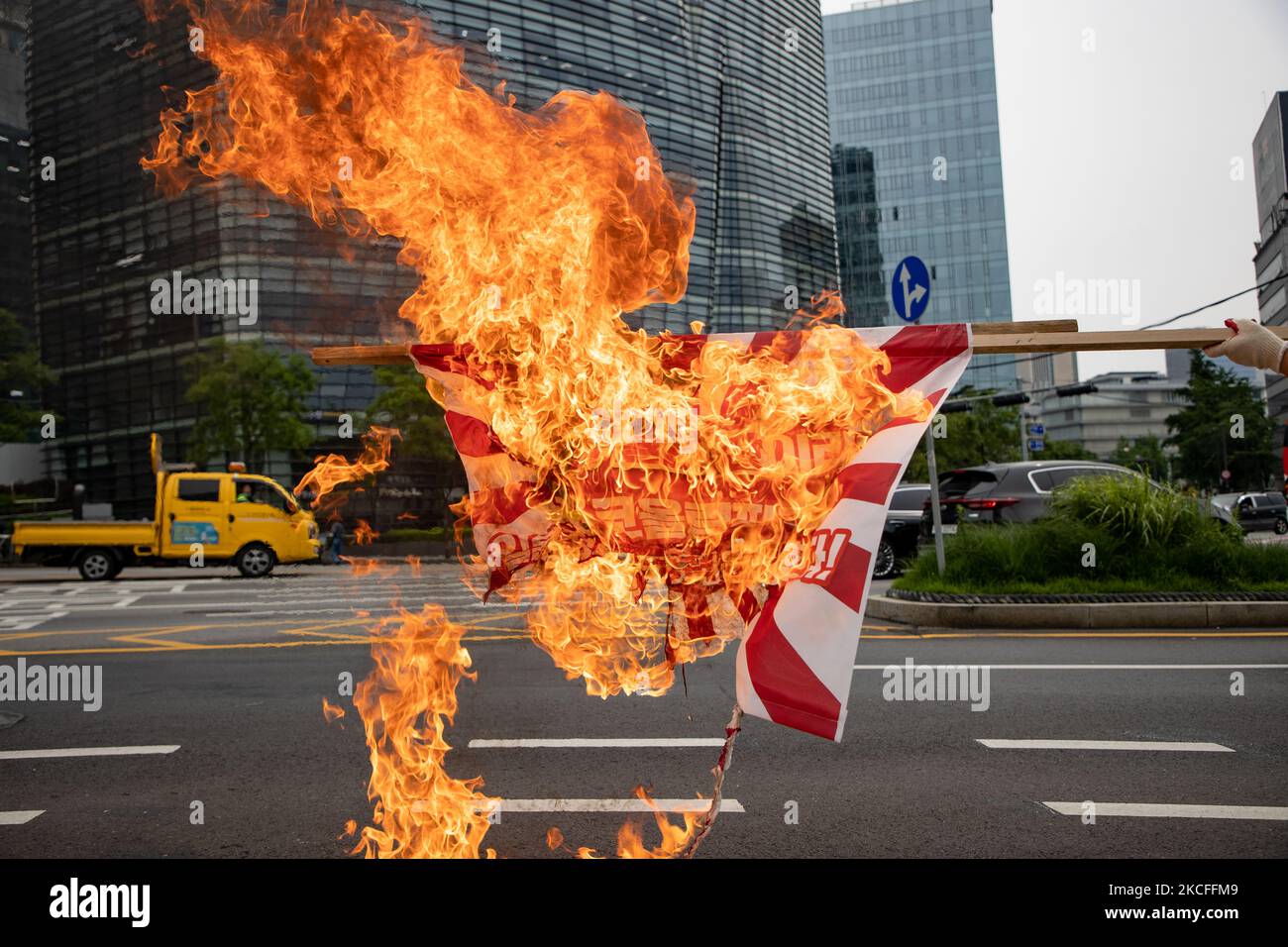 Members of the Korean University Student Progressive Association burn ...