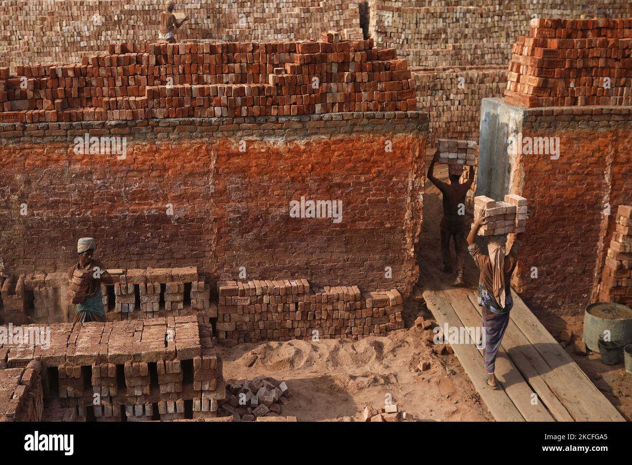 Seasonal Migrant workers during work at a brick-making field in Dhaka ...
