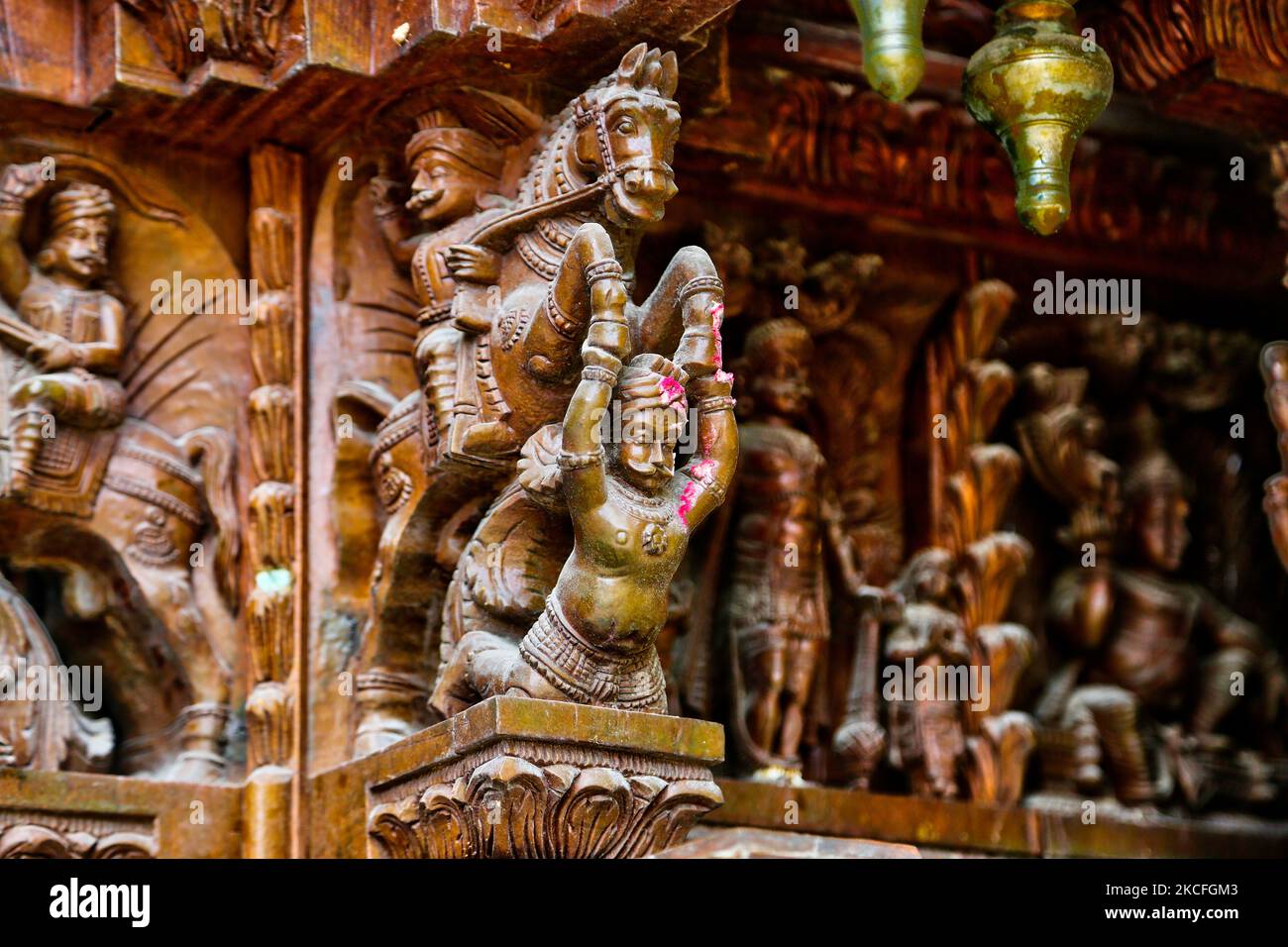 Detailed wooden carvings adorn the large chariot (ther) at the Ayyanar ...
