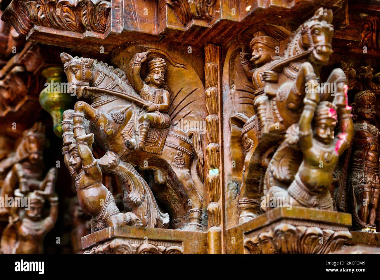 Detailed wooden carvings adorn the large chariot (ther) at the Ayyanar ...