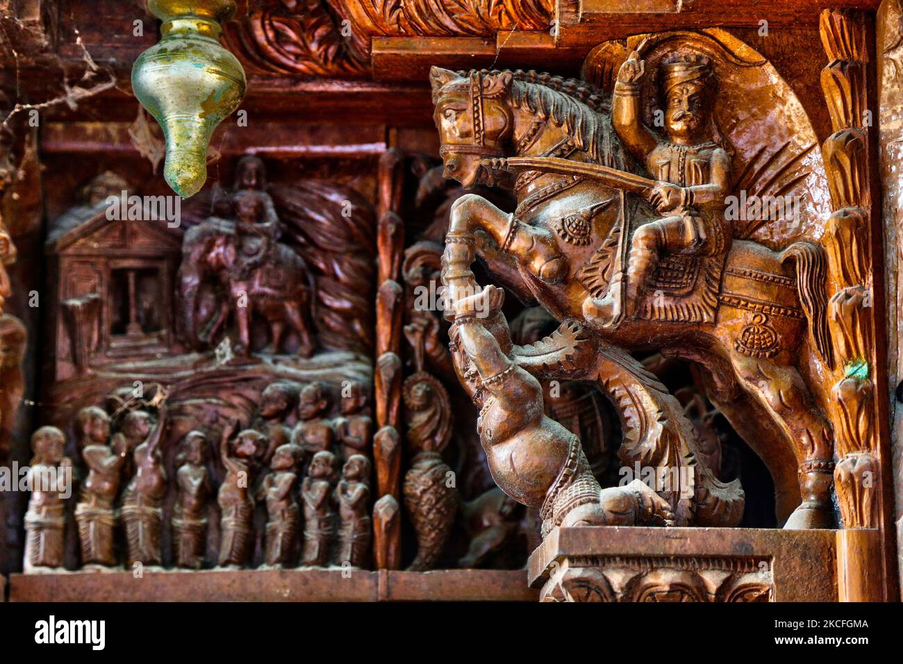 Detailed wooden carvings adorn the large chariot (ther) at the Ayyanar ...