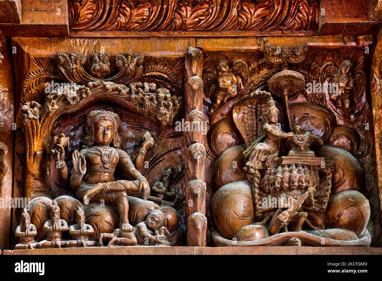 Detailed wooden carvings adorn the large chariot (ther) at the Ayyanar ...