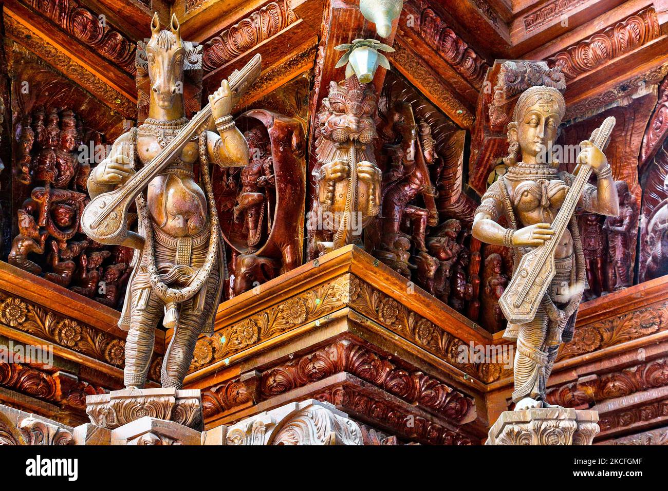 Detailed wooden carvings adorn the large chariot (ther) at the Ayyanar ...