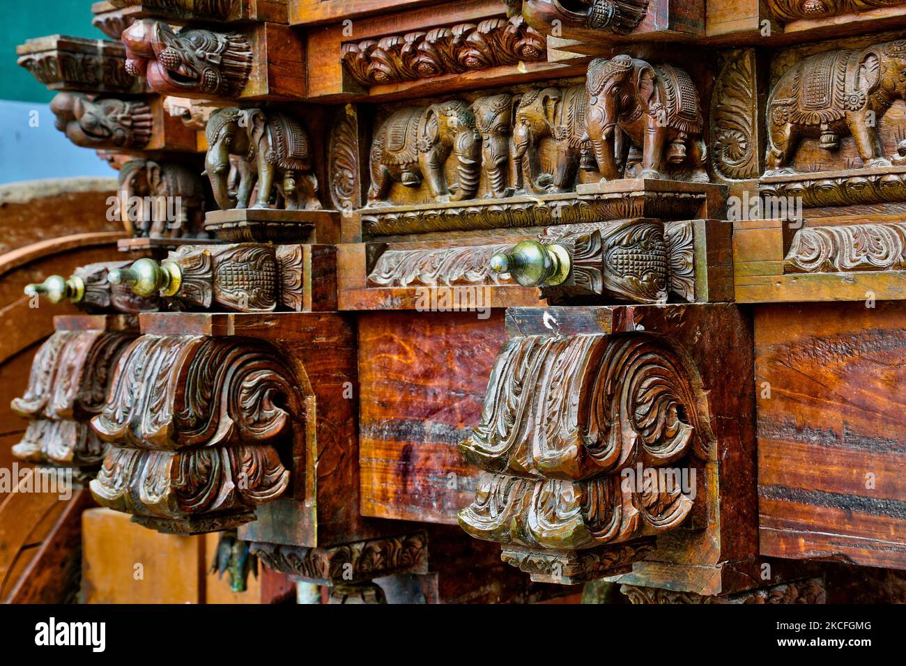 Detailed wooden carvings adorn the large chariot (ther) at the Ayyanar ...