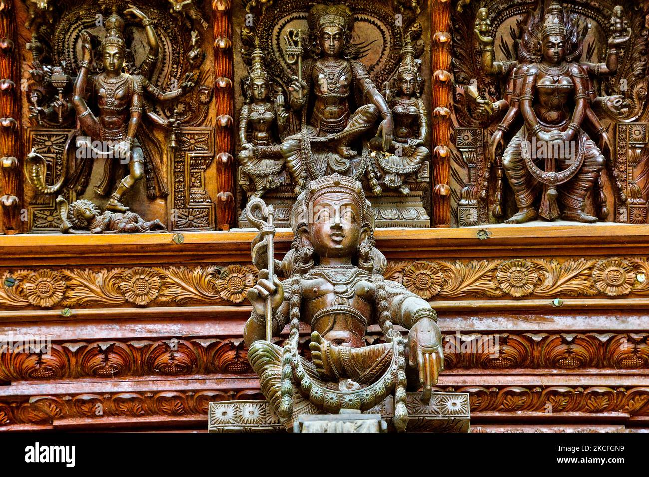Detailed wooden carvings adorn the large chariot (ther) at the Ayyanar ...