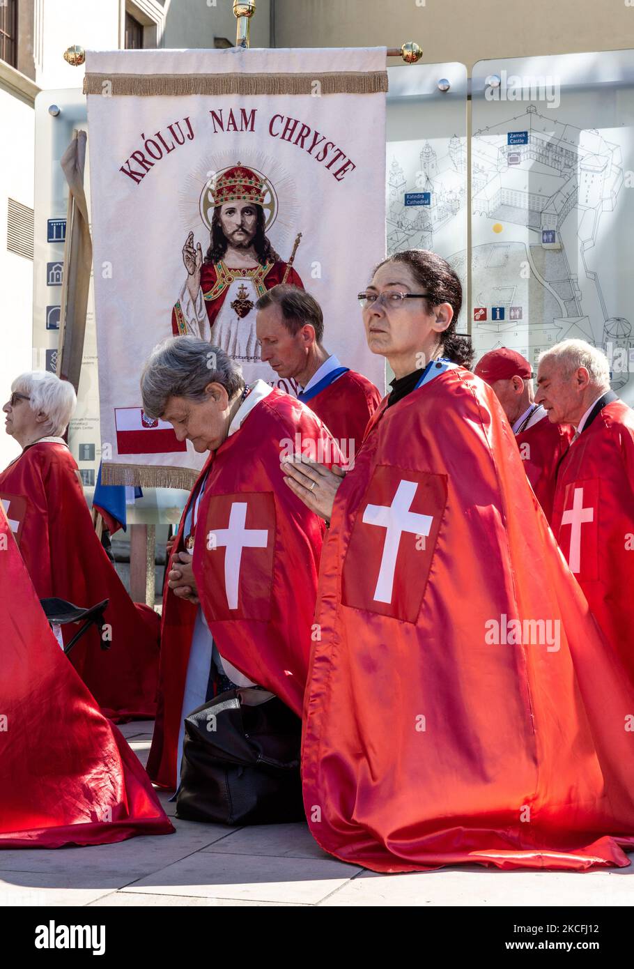 Priests and the faithful walk in the procession of the Holy Body and ...