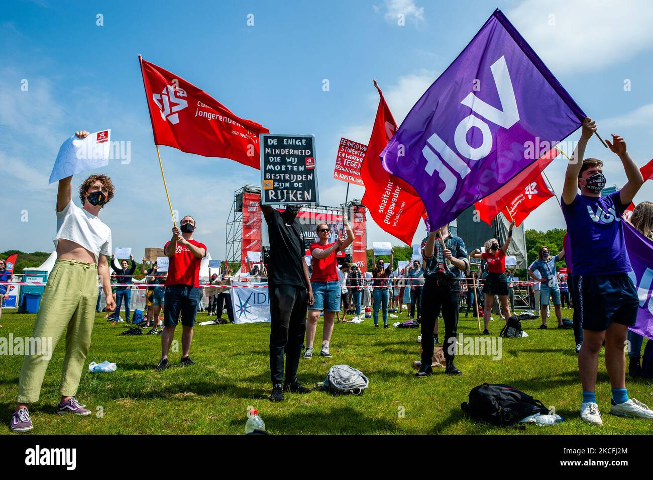 Several students are holding flags from different political parties ...