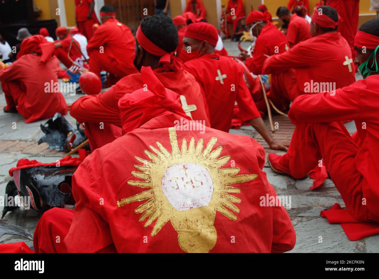 Men dressed as dancing Devils listen to a mass during the Corpus ...