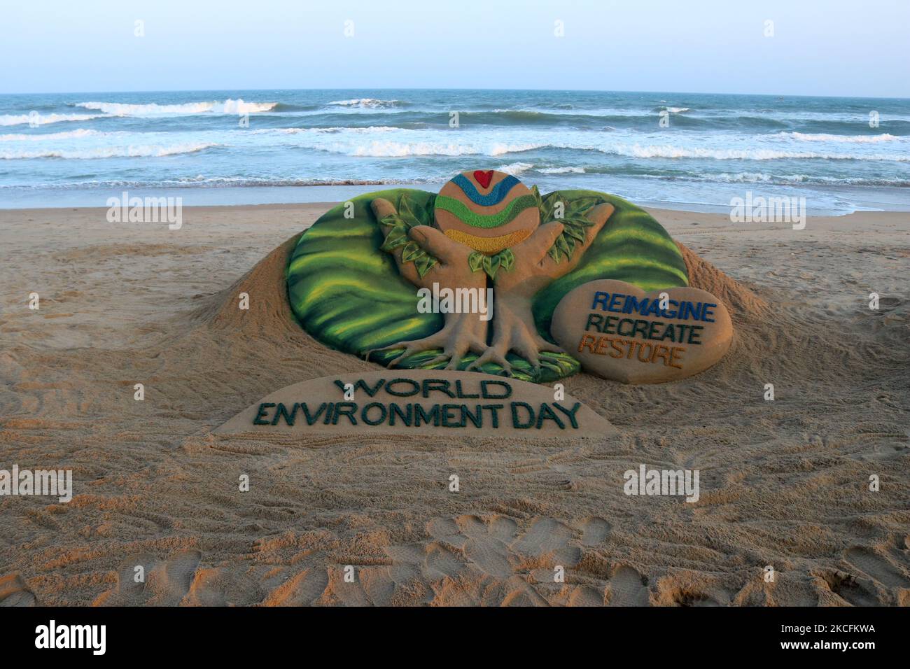 Environment Day sand sculpture is seen at the Bay of Bengal Sea's Puri ...