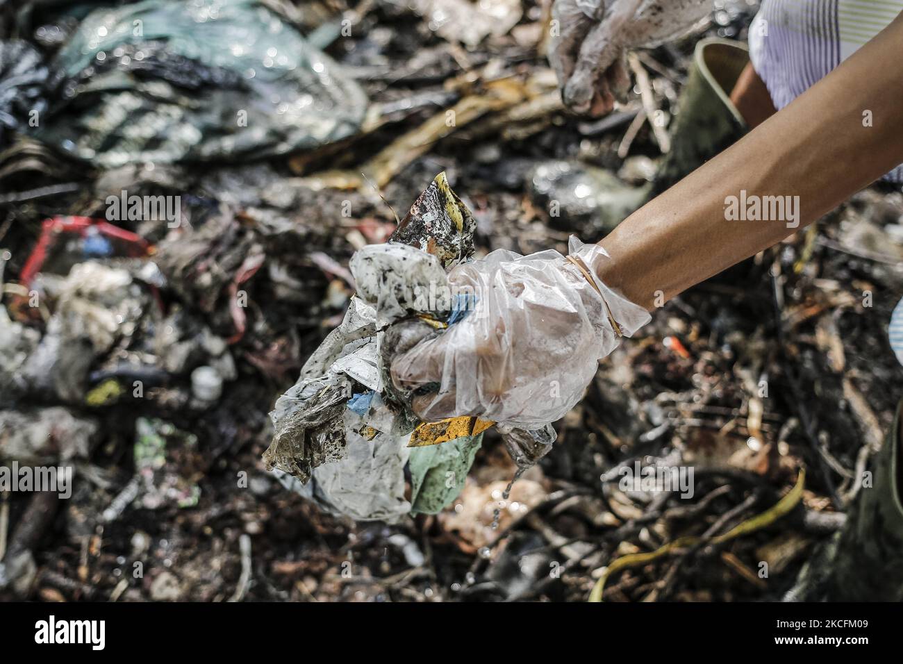 Volunteers of Sungai Watch take part in cleaning river canal from ...
