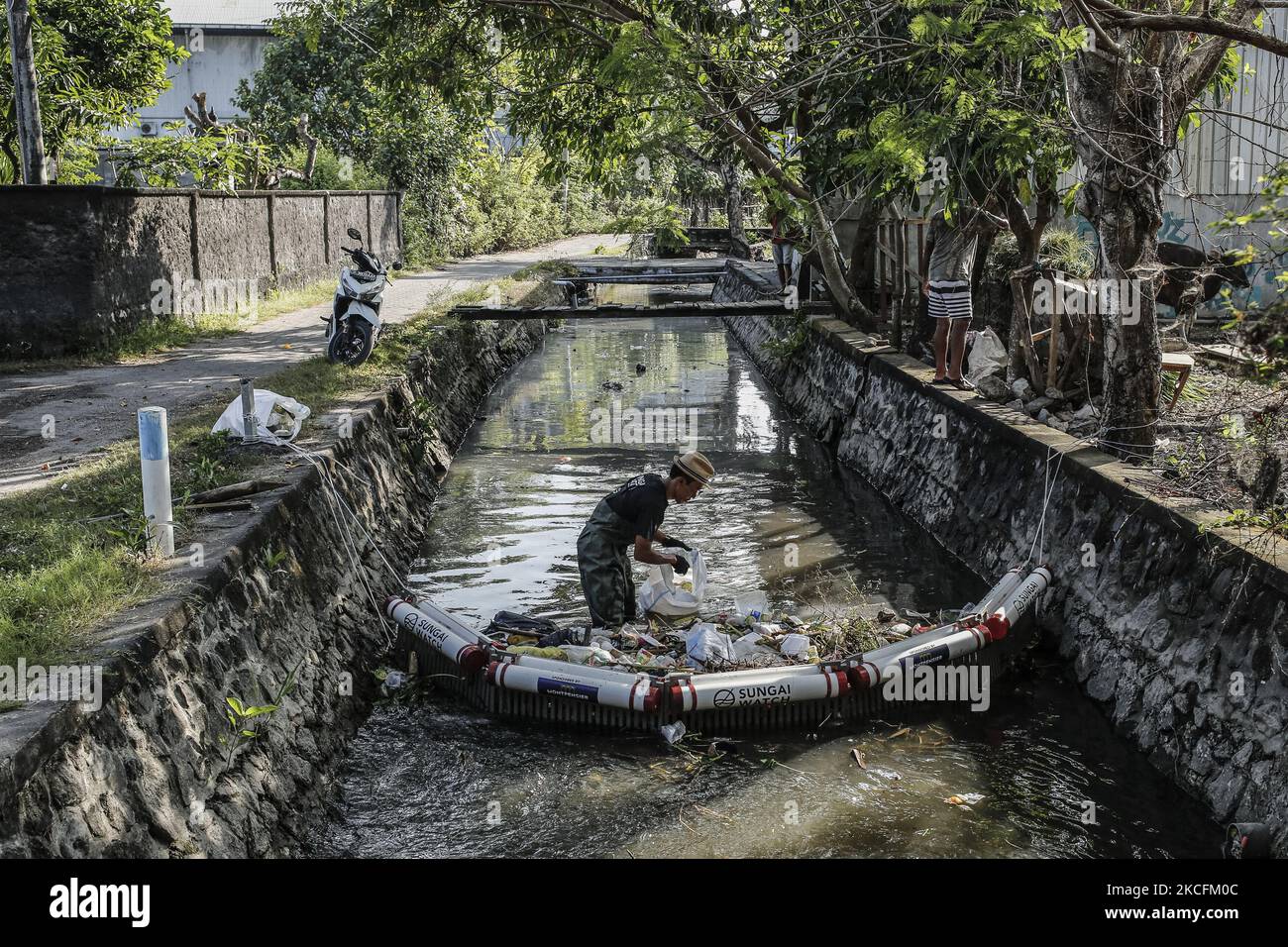 Volunteers of Sungai Watch take part in cleaning river canal from ...