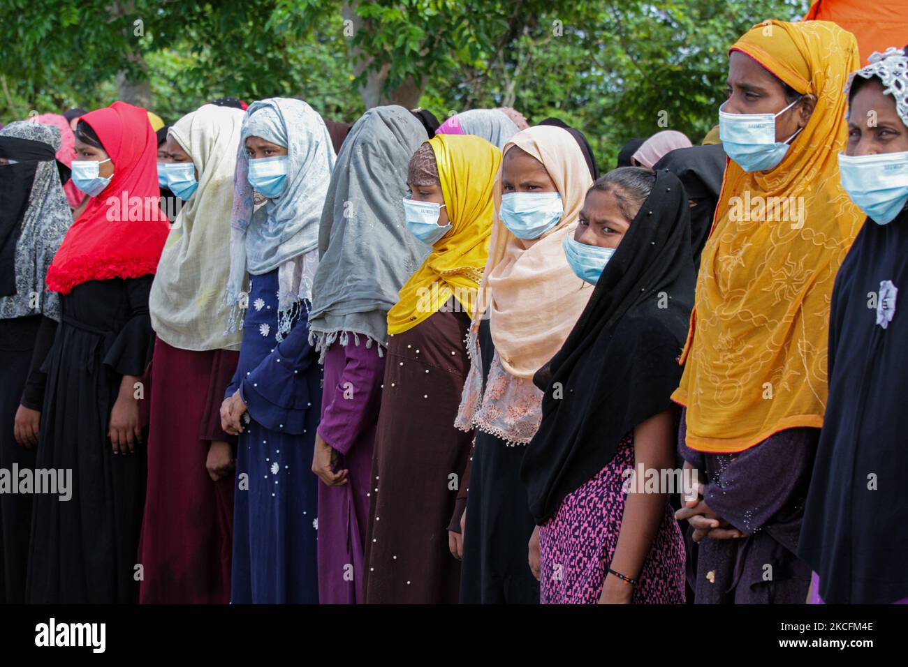 An ethnic Rohingya is seen in a temporary shelter after their boat ...