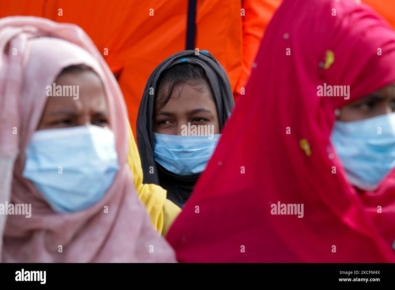 An ethnic Rohingya is seen in a temporary shelter after their boat ...