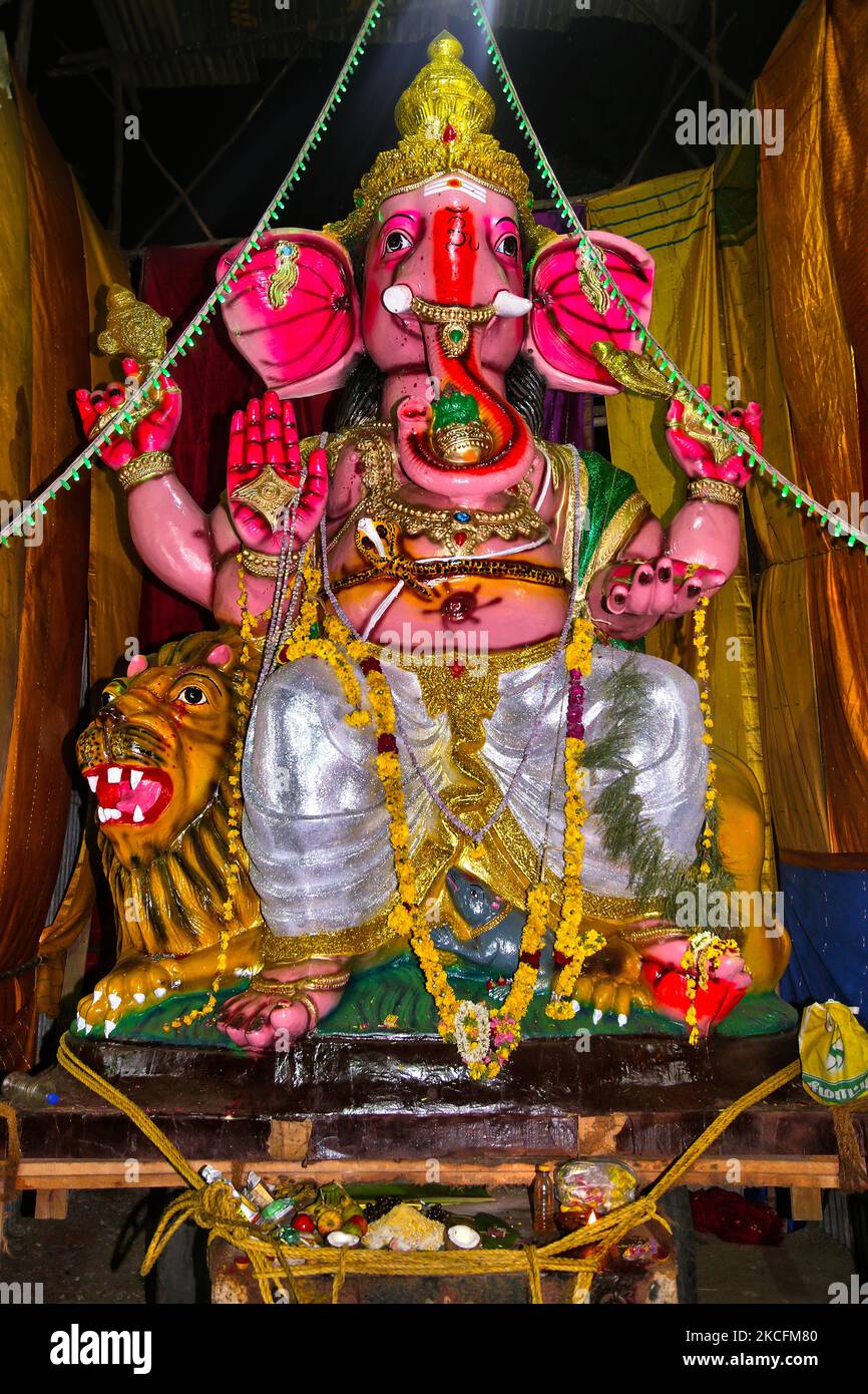 Large clay idol of Lord Ganesha (Lord Ganesh) at a pandal (temporary ...