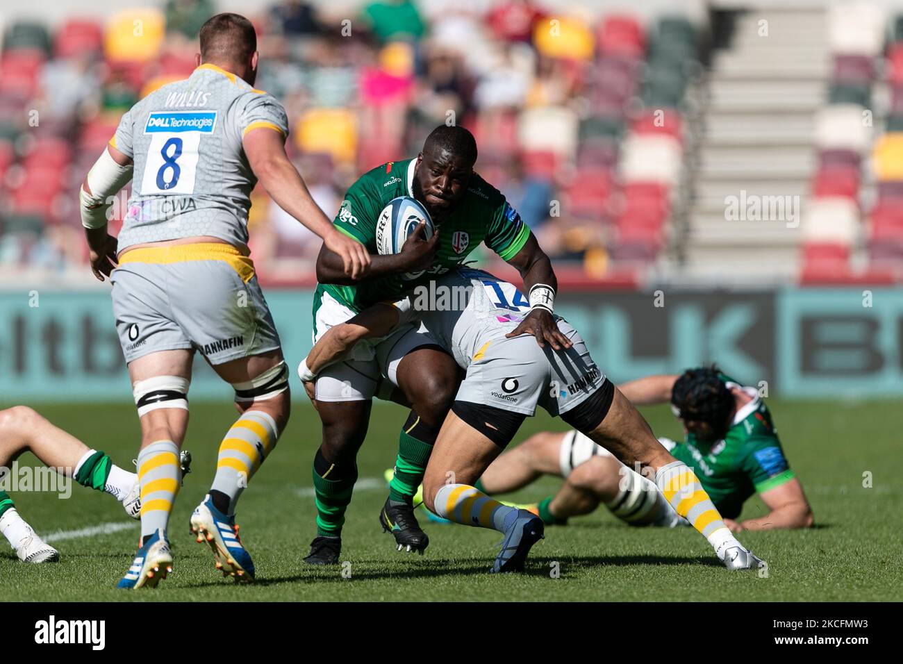 Lovejoy Chawatama of London Irish is tackled by Marcus Watson of Wasps ...