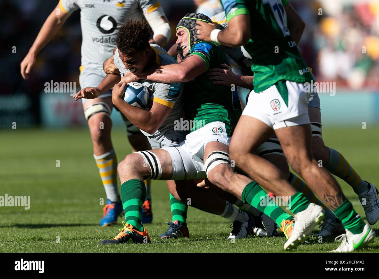 Marcus Watson of Wasps is tackled by Rob Simmons of London Irish during ...