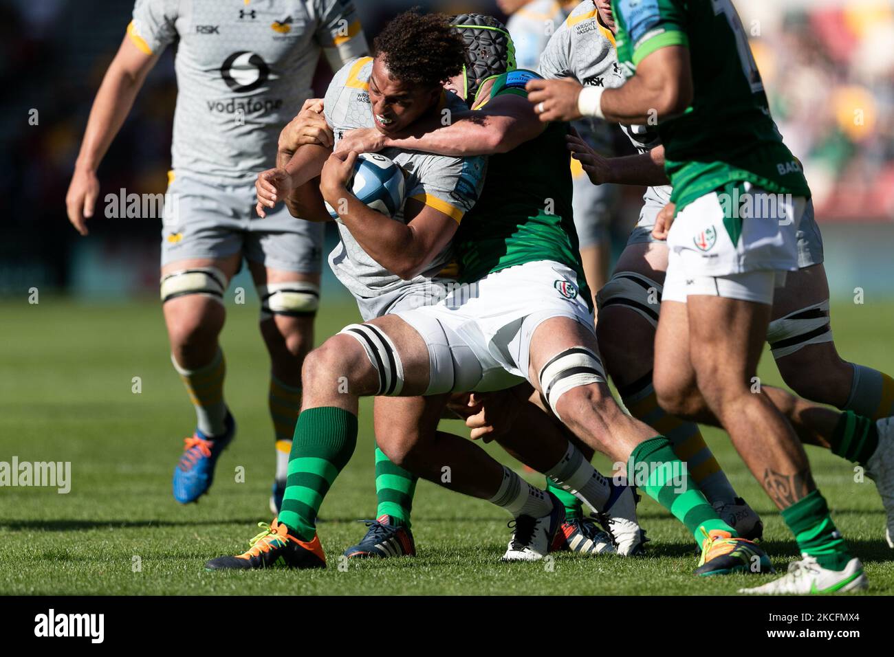 Marcus Watson of Wasps is tackled by Rob Simmons of London Irish during ...