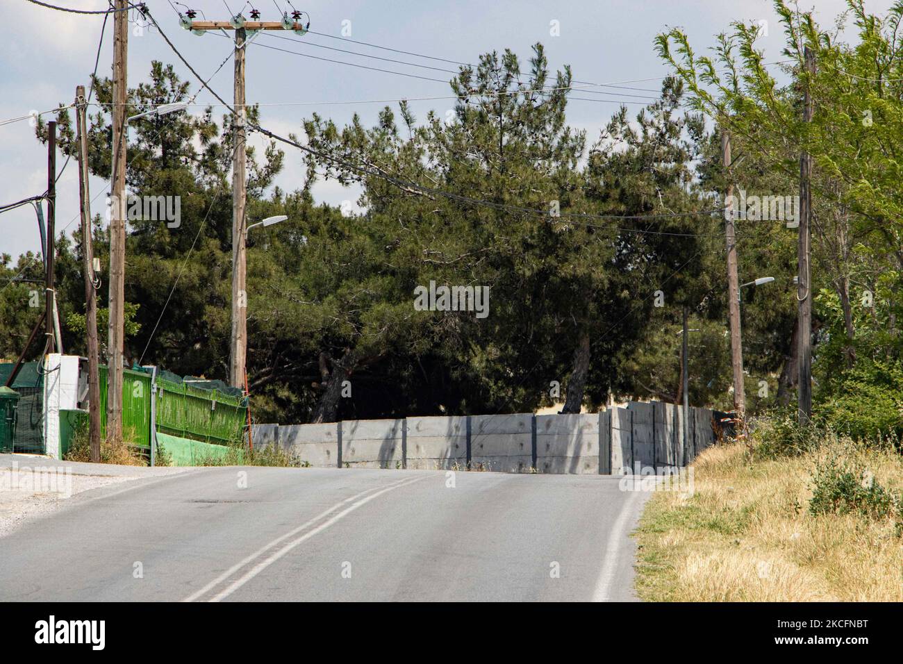 Greece is building new concrete walls around the refugee camps across ...