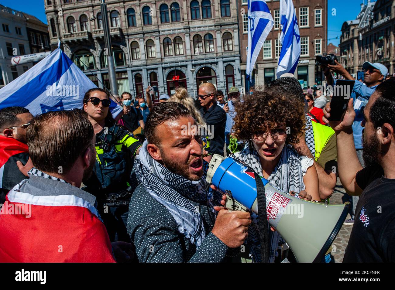 Palestinian people are confronting Israeli people demonstrating at the ...