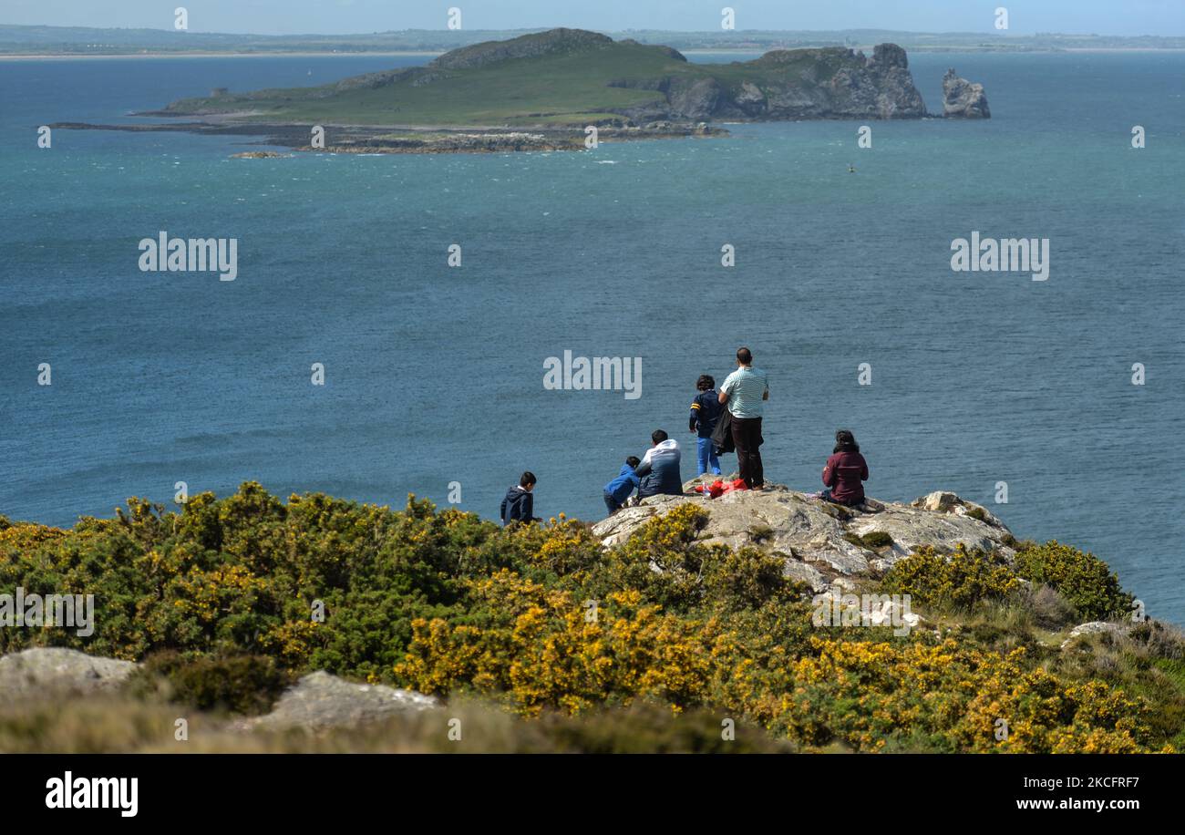 People enjoy nice weather and the Howth cliff path loop walk on the ...