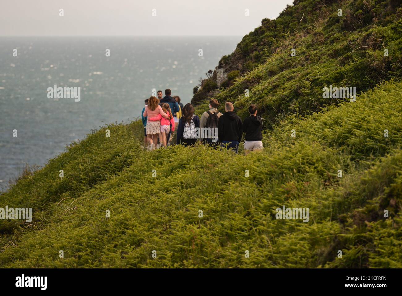 People enjoy nice weather and the Howth cliff path loop walk on the ...
