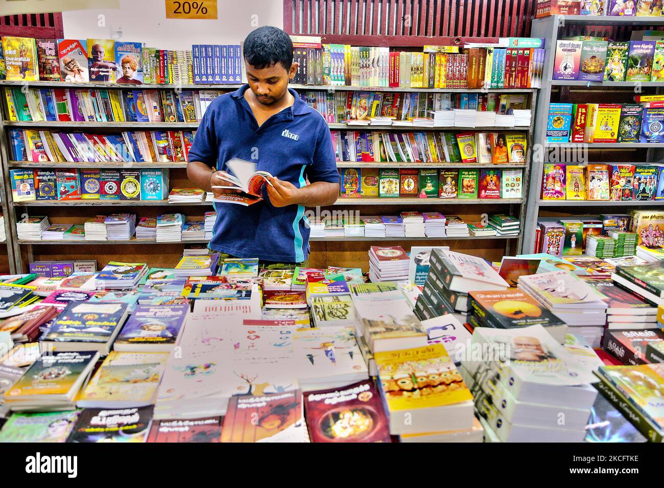 Man looks at religious books at a small bookshop in Jaffna Sri Lanka ...